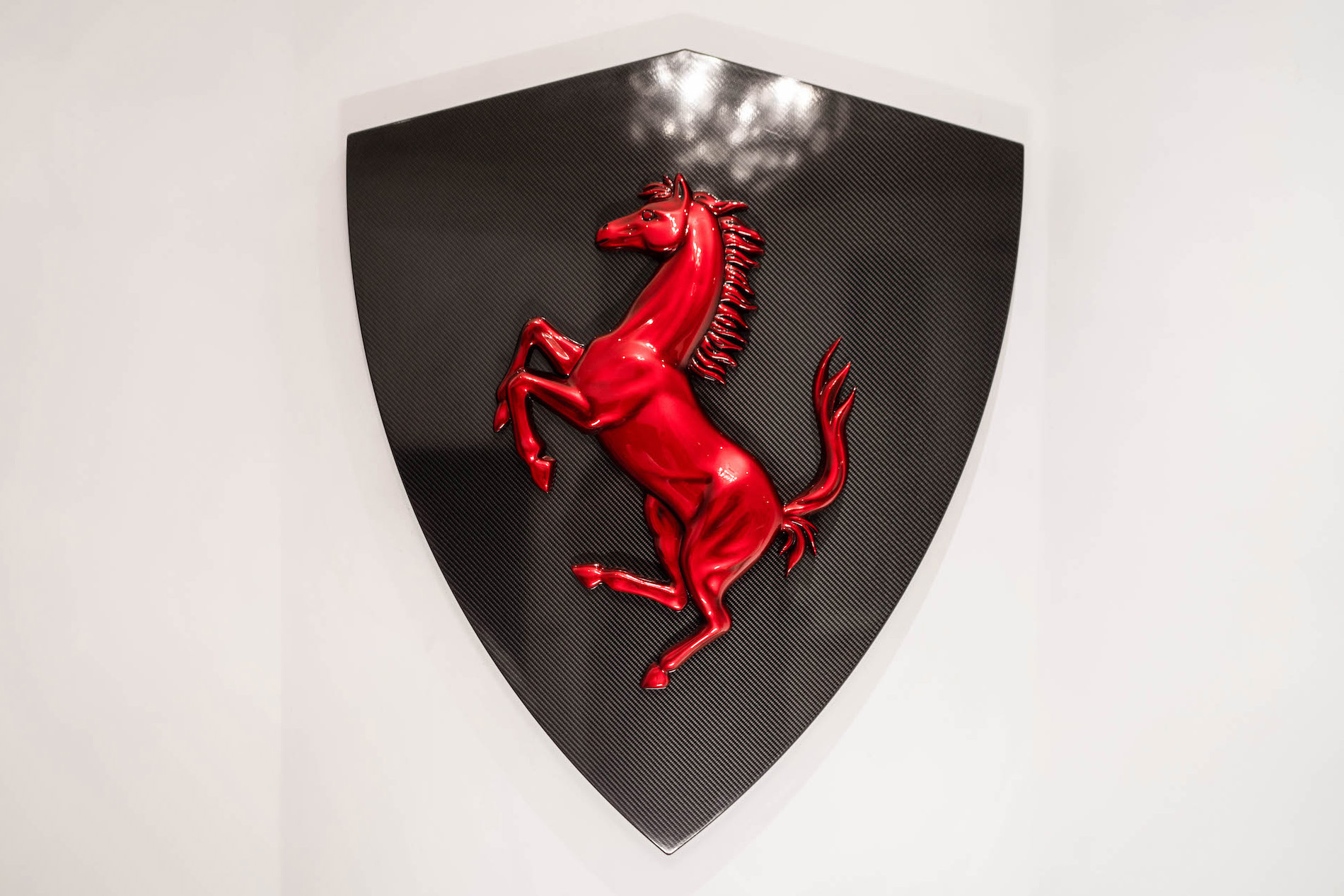 CHARITY AUCTION - FERRARI CARBON-FIBRE SHIELD WALL ART