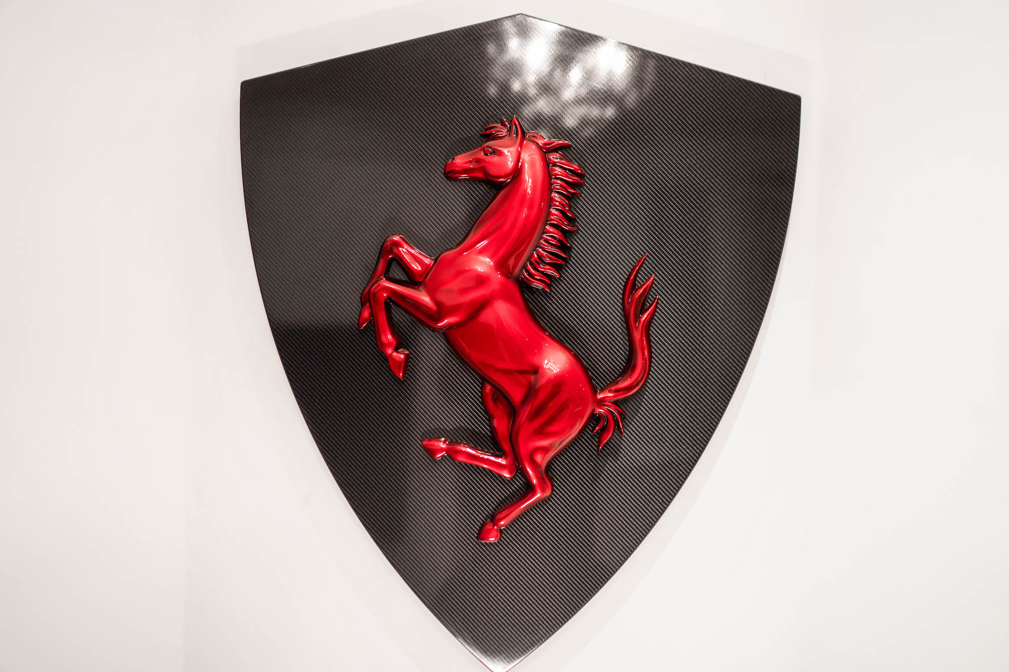 CHARITY AUCTION - FERRARI CARBON-FIBRE SHIELD WALL ART