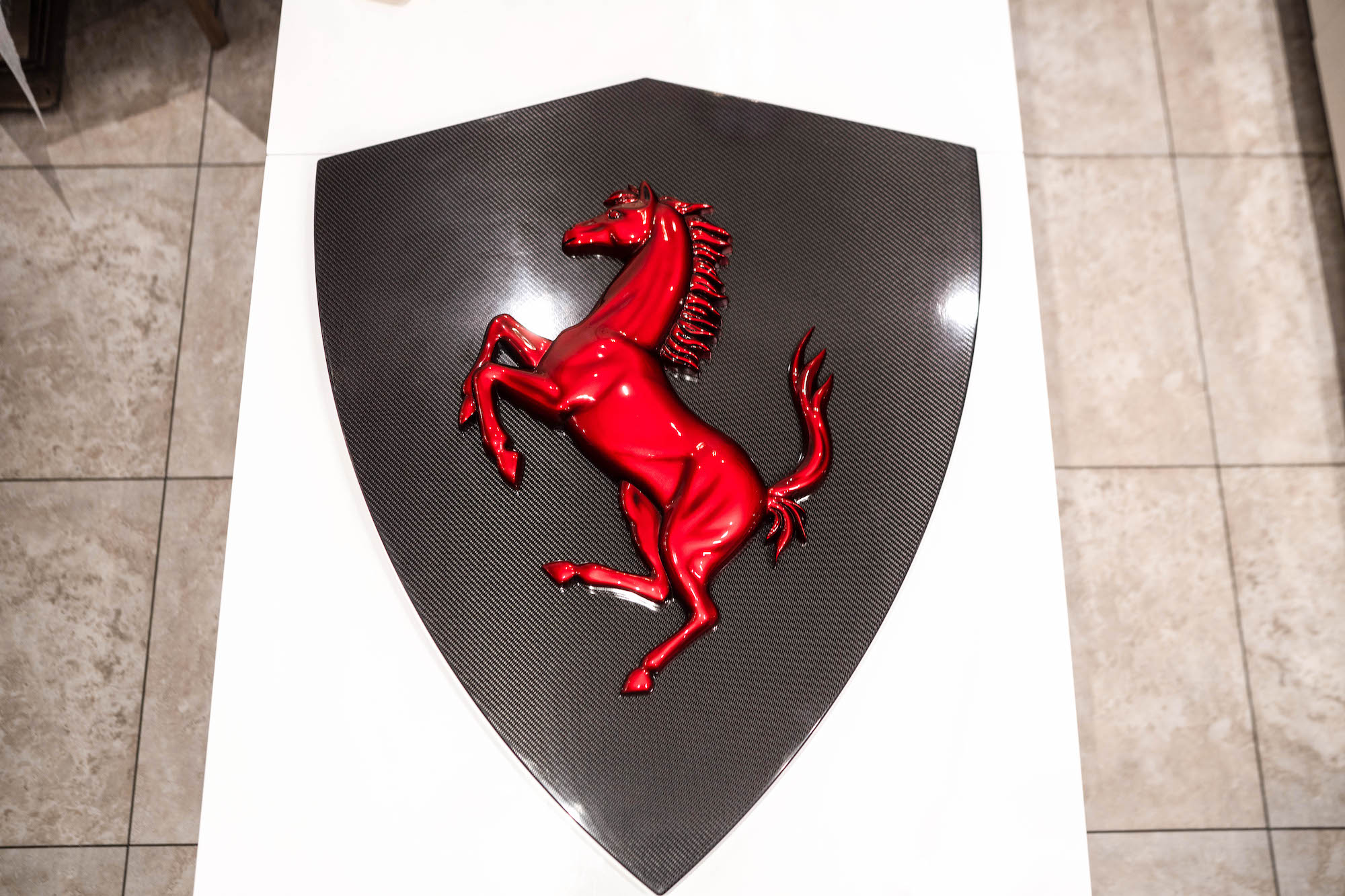CHARITY AUCTION - FERRARI CARBON-FIBRE SHIELD WALL ART