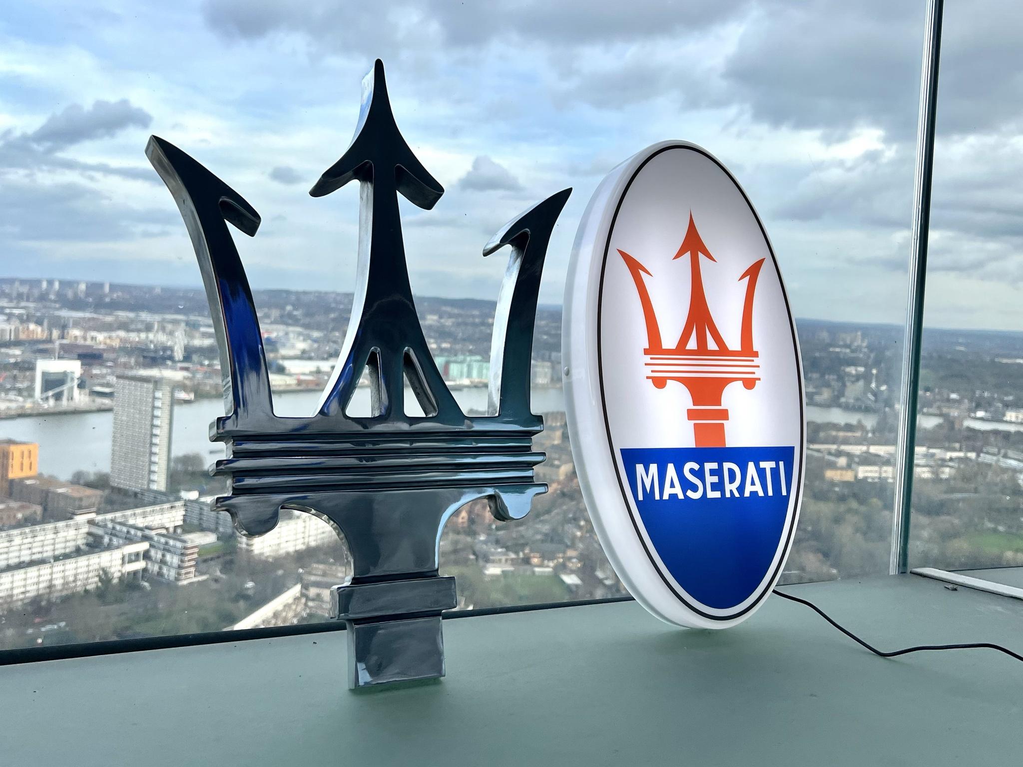 MASERATI TRIDENT AND ILLUMINATED OVAL SIGNS